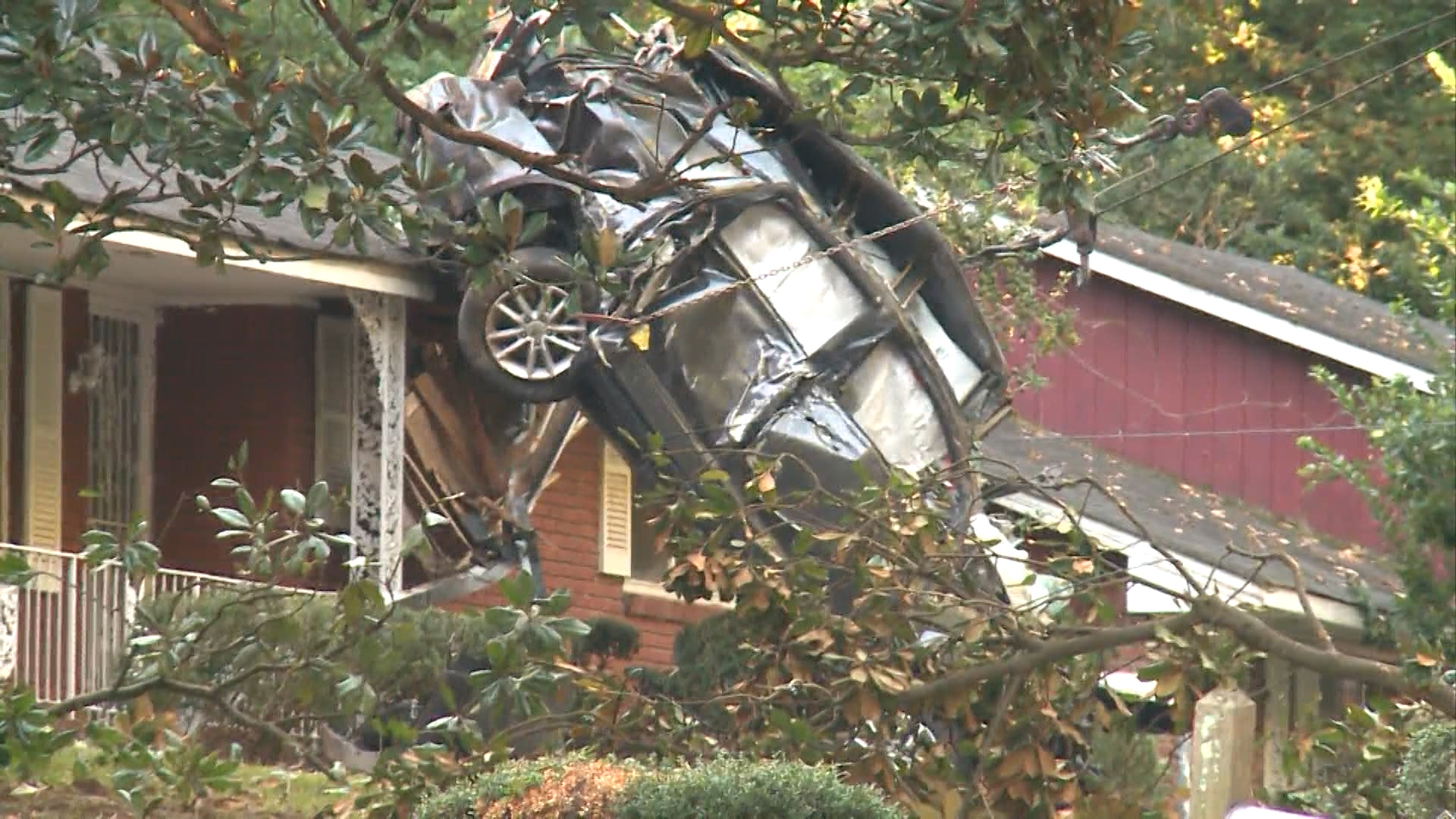 Teen flips car, lands on house | wkyc.com